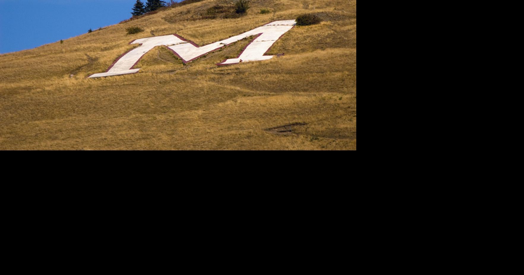 Hillside letters, symbols of town and school pride, are stamped on the ...
