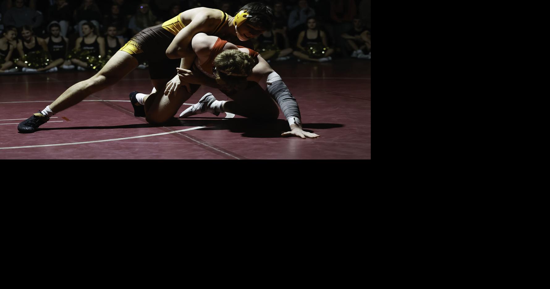 Cole Graham sets Capital wrestling win record, Bruins sweep crosstown