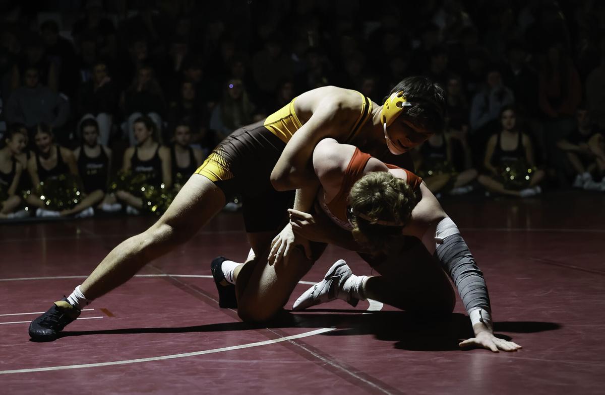 Cole Graham sets Capital wrestling win record, Bruins sweep crosstown