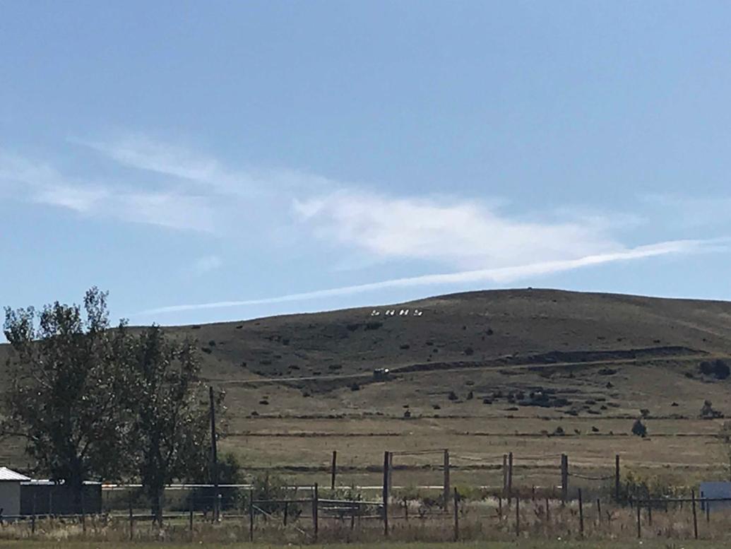 Photos of Montana's hillside letters