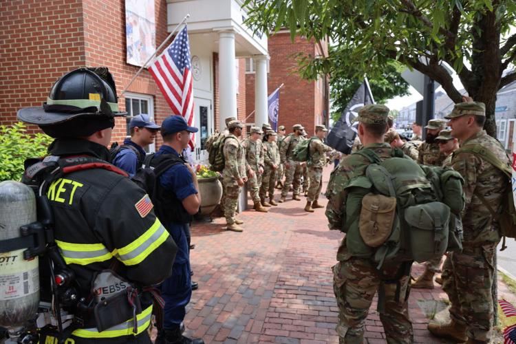 Soldiers "ruck march" through downtown to celebrate U.S. Army's 250th ...