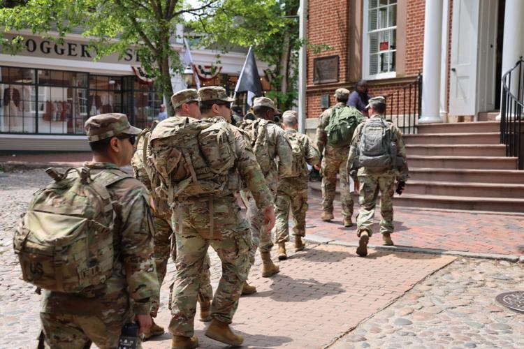 Soldiers "ruck march" through downtown to celebrate U.S. Army's 250th ...