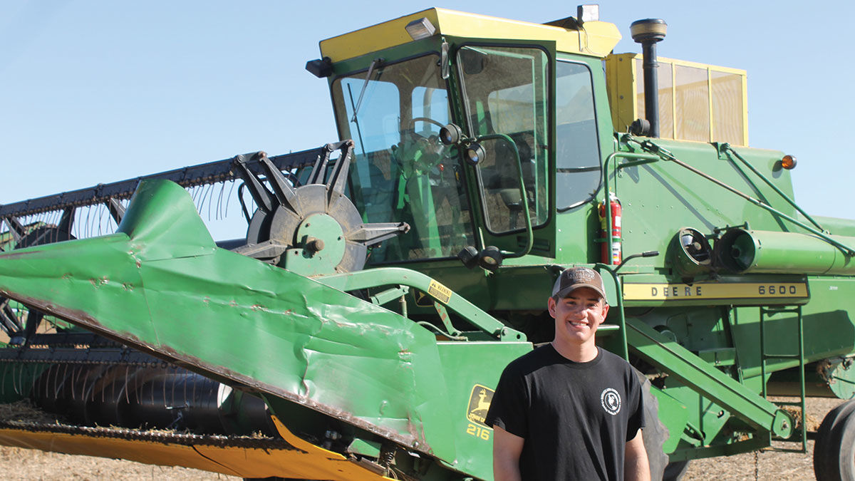 Storied combine brings fun to harvest for father and son