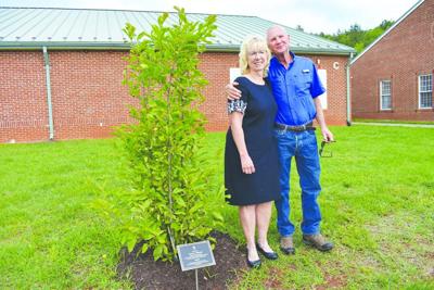 FCA honors Lisa Moore’s 30 years of service with tree dedication ...