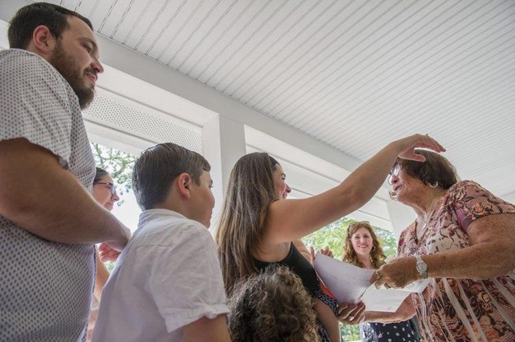 Lucky family moves into new home built by GLTS students, ACT ...