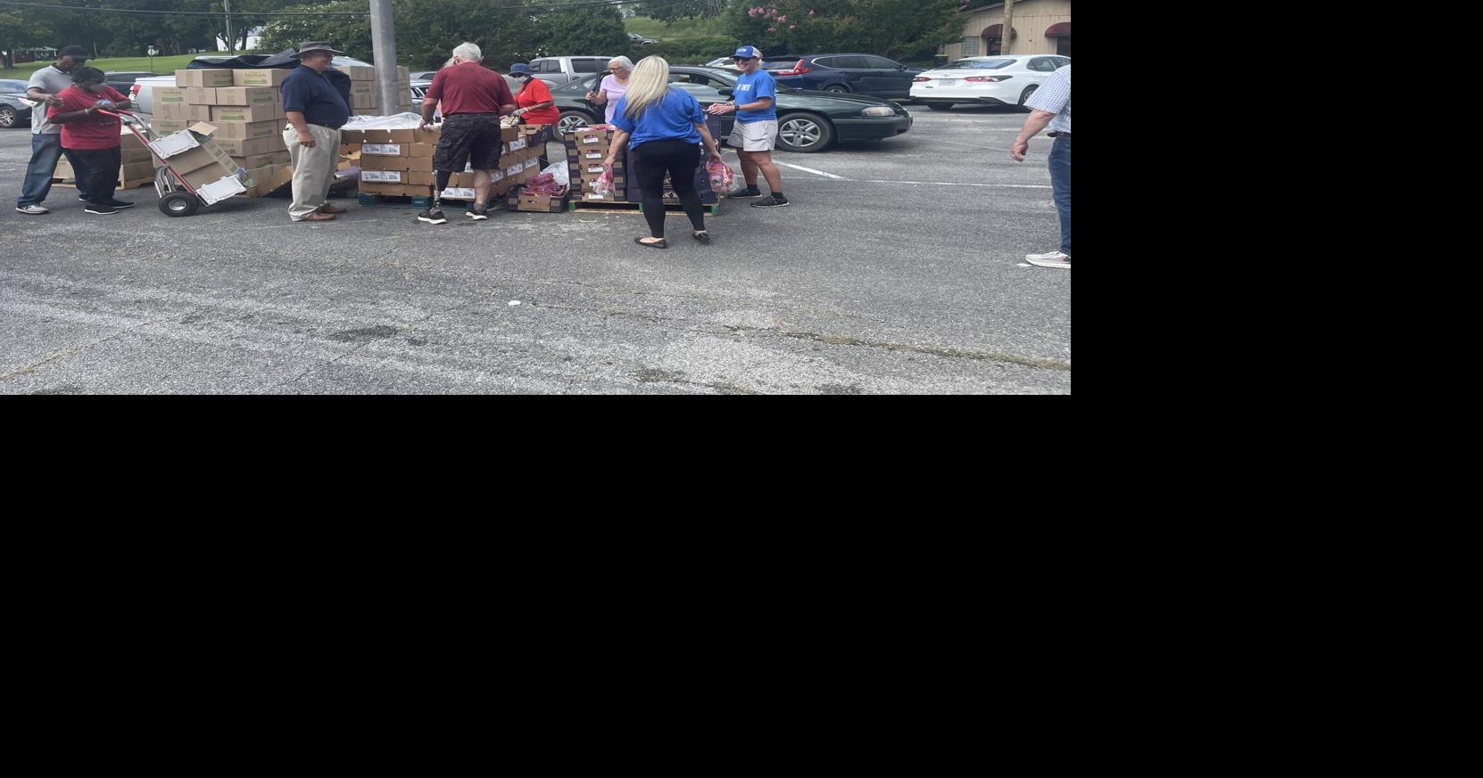 Volunteers pass out food boxes Thursday morning | News | annistonstar.com