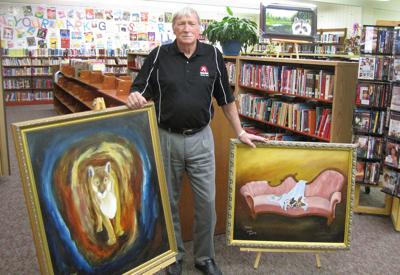 Earl Scoggins has developed his own style when it comes to painting ...