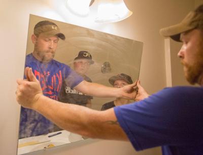 Habitat for Humanity volunteers work to renovate two homes in Anniston ...