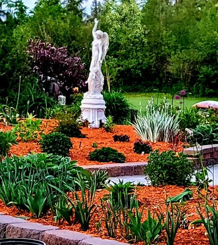 Guardian of gardens: Formal flower garden in bloom non-stop from spring ...