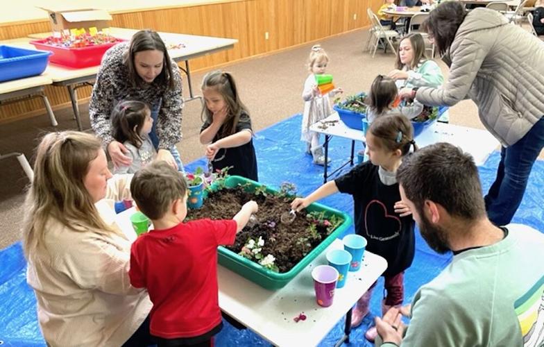 Kids at First Lutheran share flowers during Spring Service Day | News ...