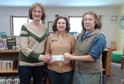 Oulu Community Theater presents check to Iron River Public Library for ...