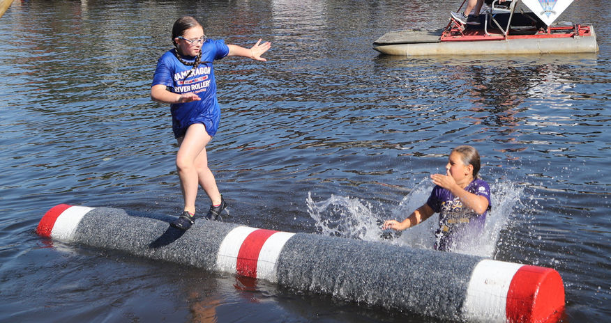 Youth participating in log rolling and boom running at the LumberJack ...