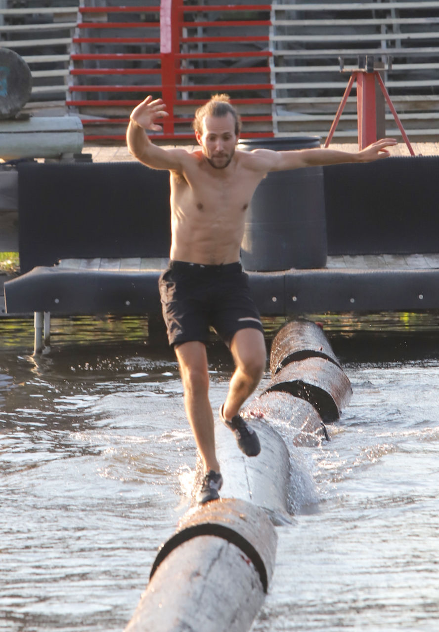 Youth participating in log rolling and boom running at the LumberJack ...