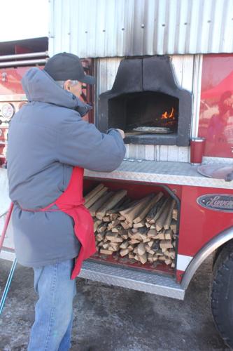 Vendor cooks pizza in a fire truck | Local | apg-wi.com