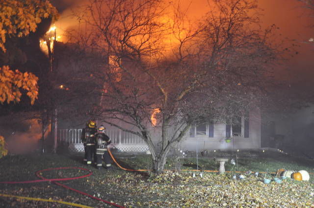 Area firefighters battle house fire | Corunna | argus-press.com