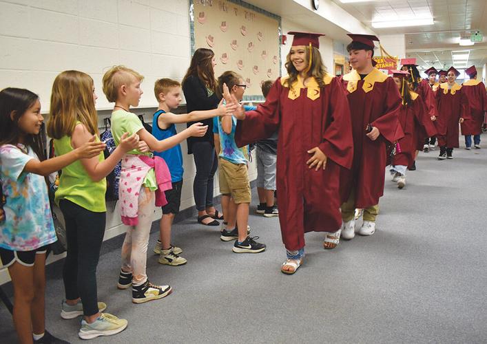 Young students greet seniors during Grad Walk | Local News ...