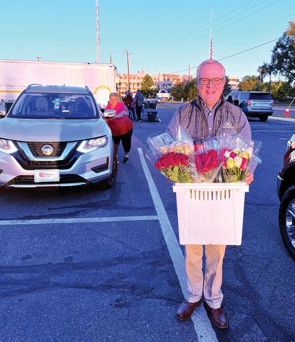 Rotarians sell roses to support education | Valley Life | argusobserver.com