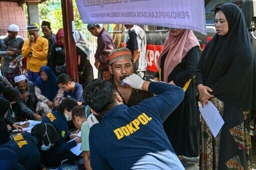 Rescuers say no more signs of life in rubble of collapsed Indonesian ...