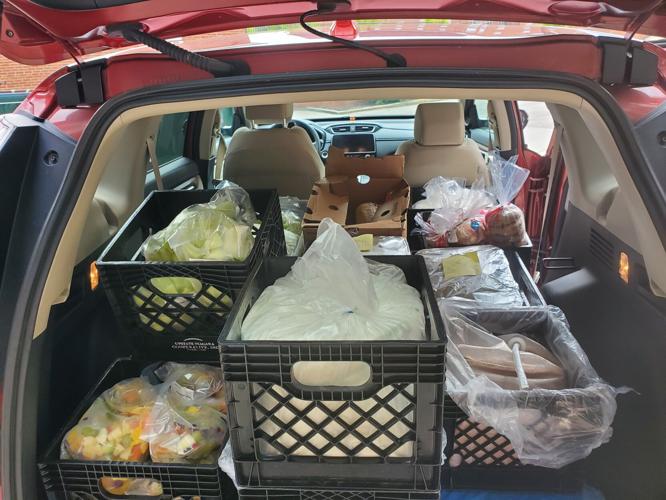 Volunteers save food from trash bins, make it available to those in ...