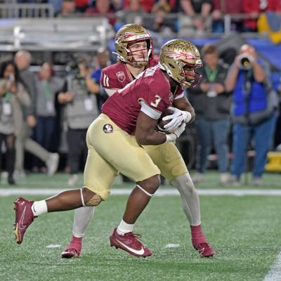 Sports: Awashed in controversy College Football final four is set ...