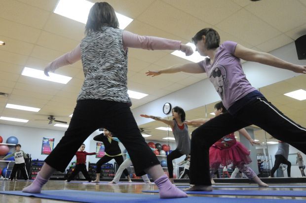 Family yoga class at Auburn YMCA