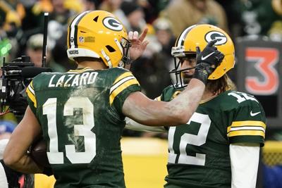 Rodgers sets team record as Packers hold off Browns 24-22