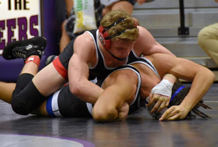 Wresting qualifies eight for state tournament, claims seven regional ...