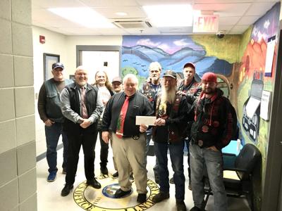 Ghost Riders Motorcycle Club presents money to Shop with a Cop program ...