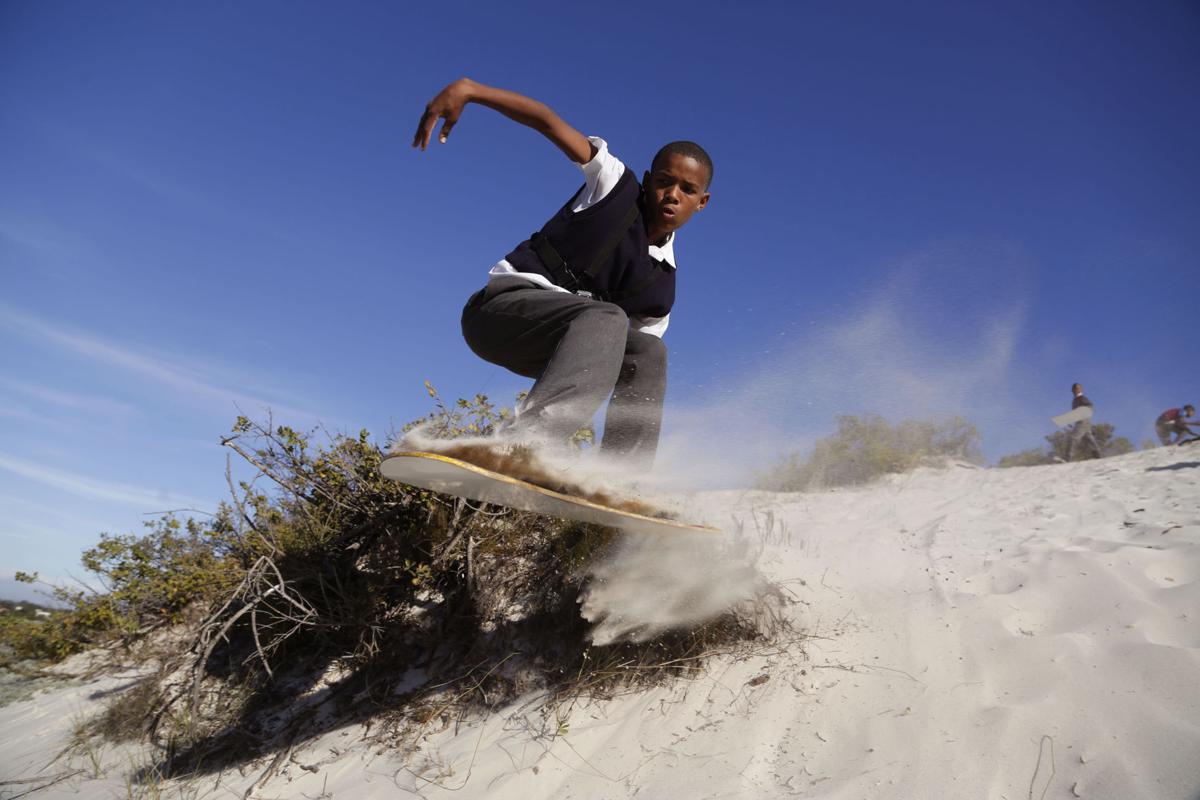 Photos: Sandboarding offers escape in the dunes of Atlantis | World ...
