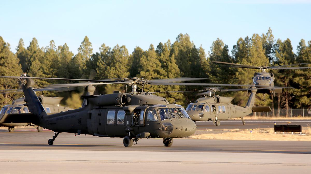 Photos: U.S. Army Chinook, Black Hawk and Apache helicopters stopped to ...