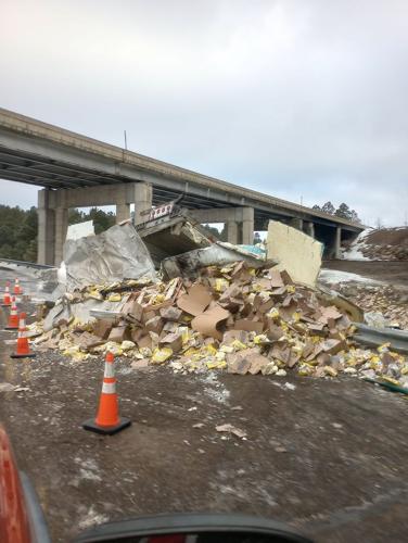 Driver uninjured after semi trailer topples from I-40 bridge onto ...