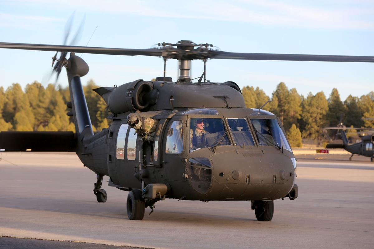 Photos: U.S. Army Chinook, Black Hawk and Apache helicopters stopped to ...