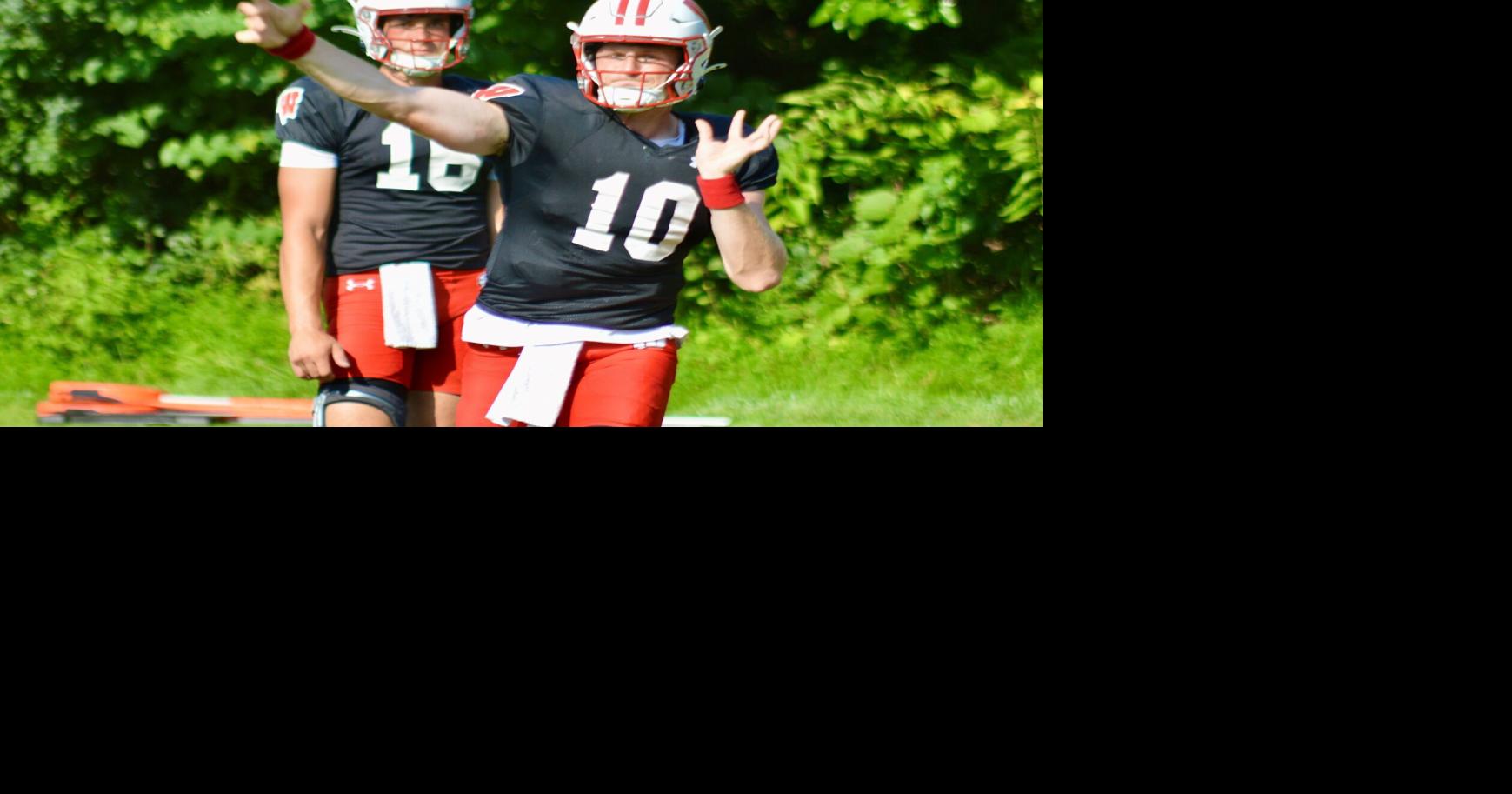 Wisconsin football photos of Tyler Van Dyke, Xavier Lucas