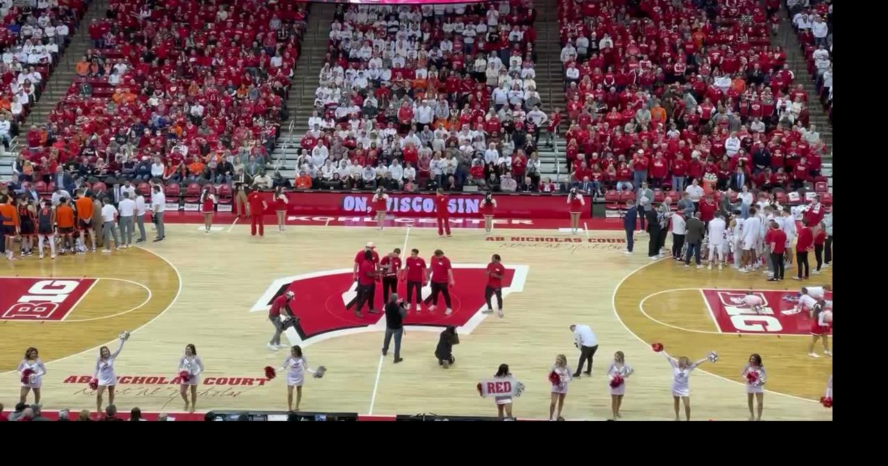 Wisconsin football players show off their Guaranteed Rate Bowl trophy