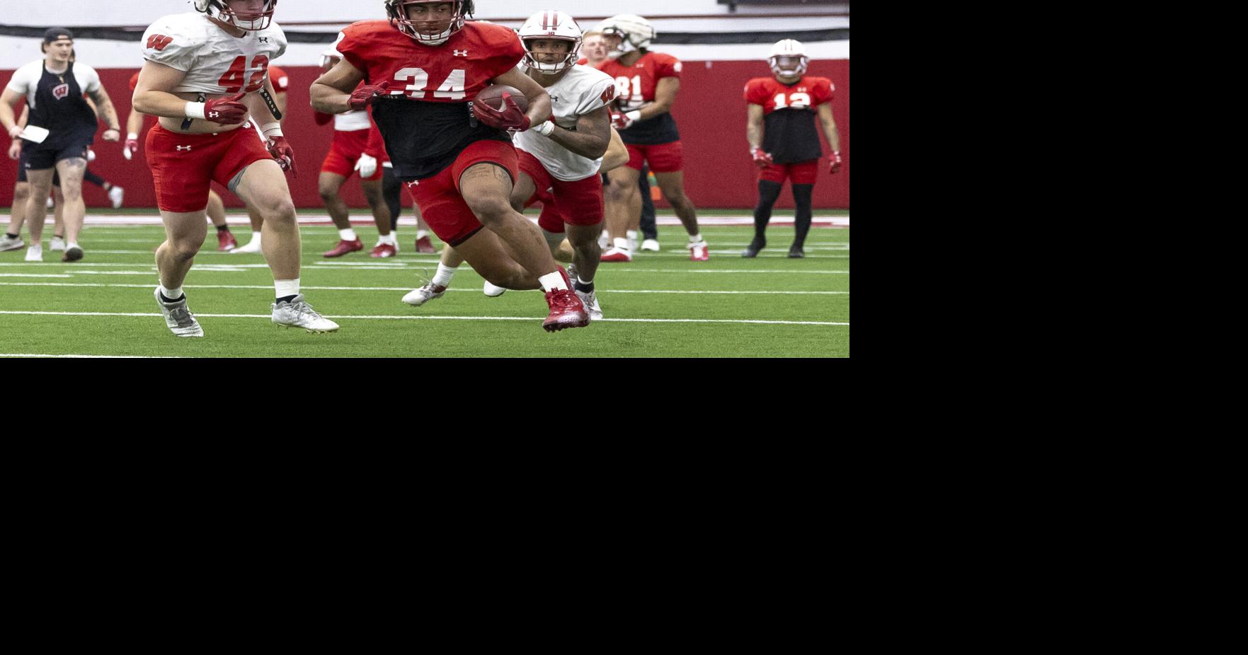 Wisconsin football players open up to one another at camp