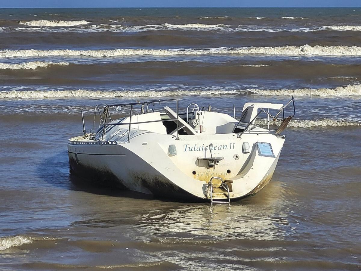 Abandoned boat adrift on beach after Coast Guard rescue | News ...