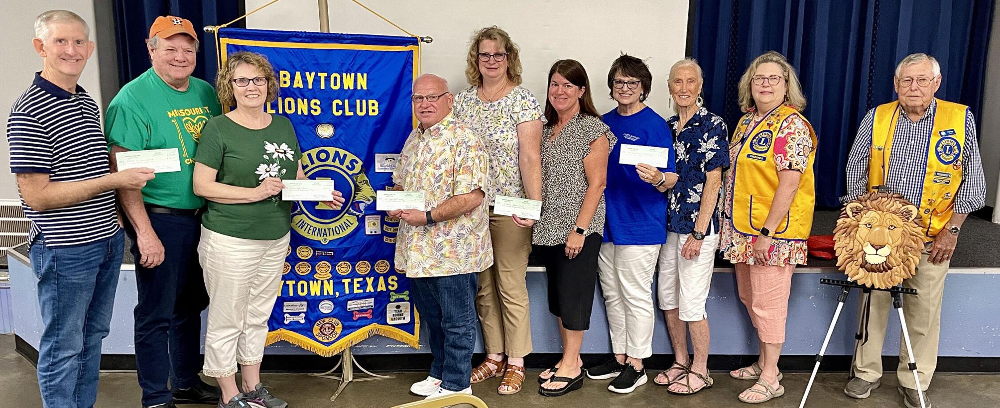 Lions Club donates to church food pantries | Local | baytownsun.com