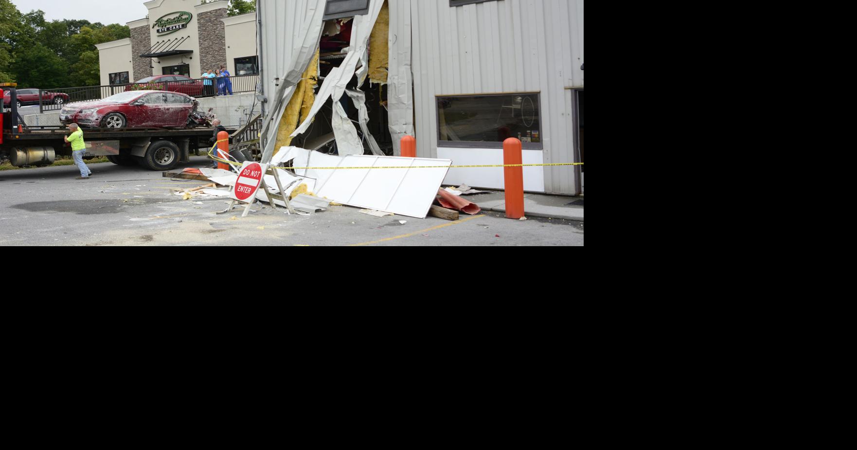 Tractor-trailer hits vehicle, crashes into side of building | News ...