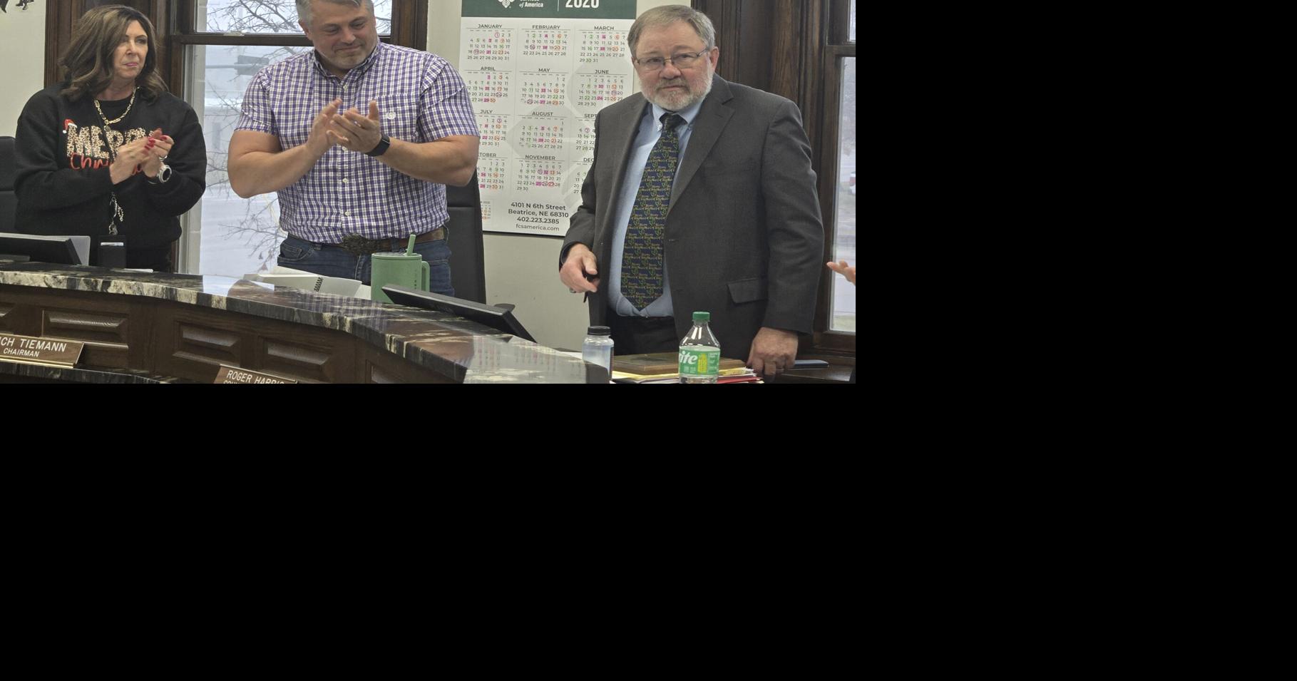 Board honors retiring County Attorney Harris, sets salaries
