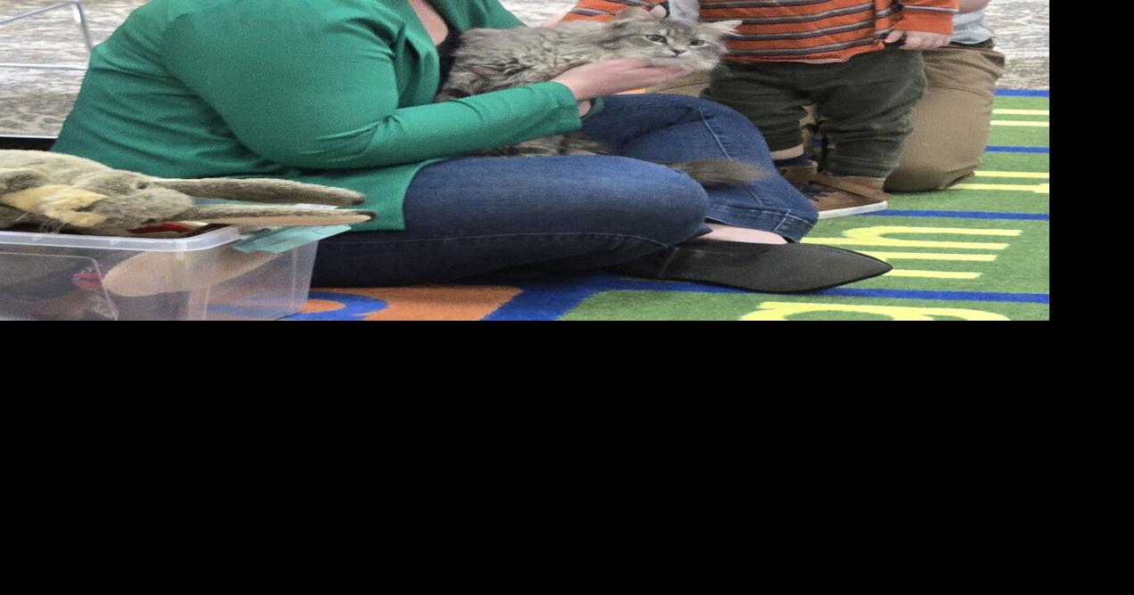 Author reading at Beatrice library mixes in pet adoption opportunity
