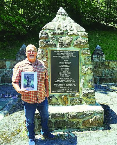 Mearkle with book | | bedfordgazette.com