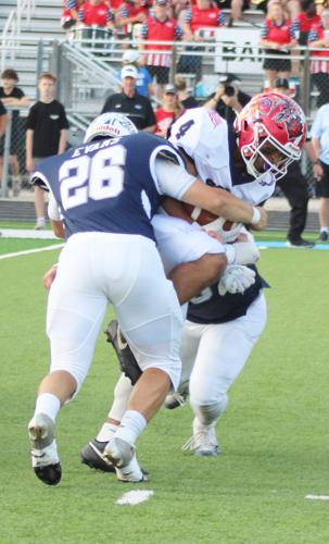 Evans tackles Harman.jpg | | bedfordgazette.com