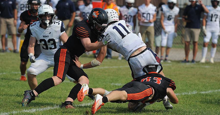 Konkol rushes for three touchdowns, intercepts a pass in Manhattan’s ...