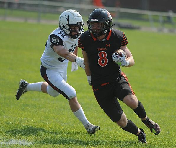 Konkol rushes for three touchdowns, intercepts a pass in Manhattan’s ...
