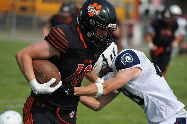 Konkol rushes for three touchdowns, intercepts a pass in Manhattan’s ...