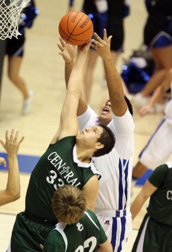 Larry McCormick of Central grabs a rebound