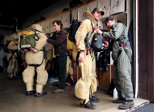 Smokejumpers prepare for fire season by parachuting into backcountry