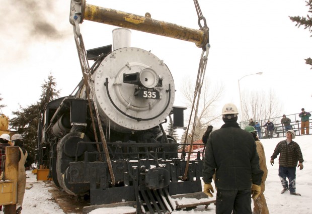 Workers move historic train in Laramie
