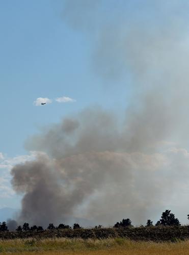 Multiple agencies battle fire northwest of Laurel