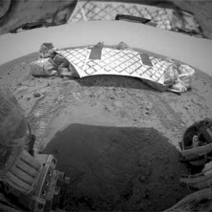 Spirit rover extends robotic arm to snap close-up images of Mars surface